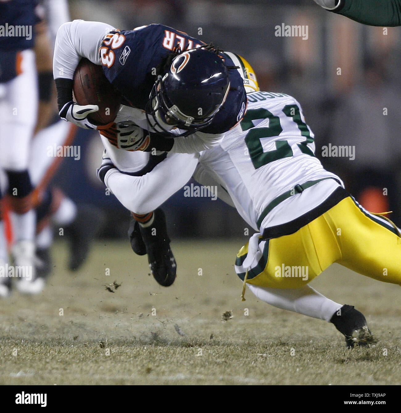 Green Bay Packers cornerback Charles Woodson (21) takes down Chicago ...