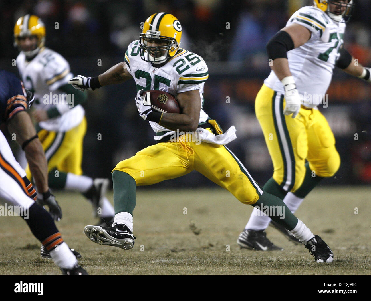 Green Bay Packers running back Ryan Grant (25) runs for a 12-yard gain ...
