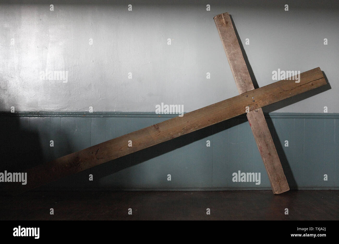 A cross to be used in the "Via Crucis" or "Way of the Cross" leans ...