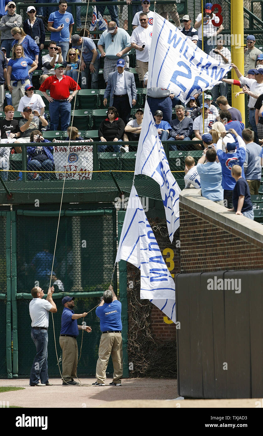 A flag bearing the number of former Chicago Cubs pitcher Greg Maddux is ...