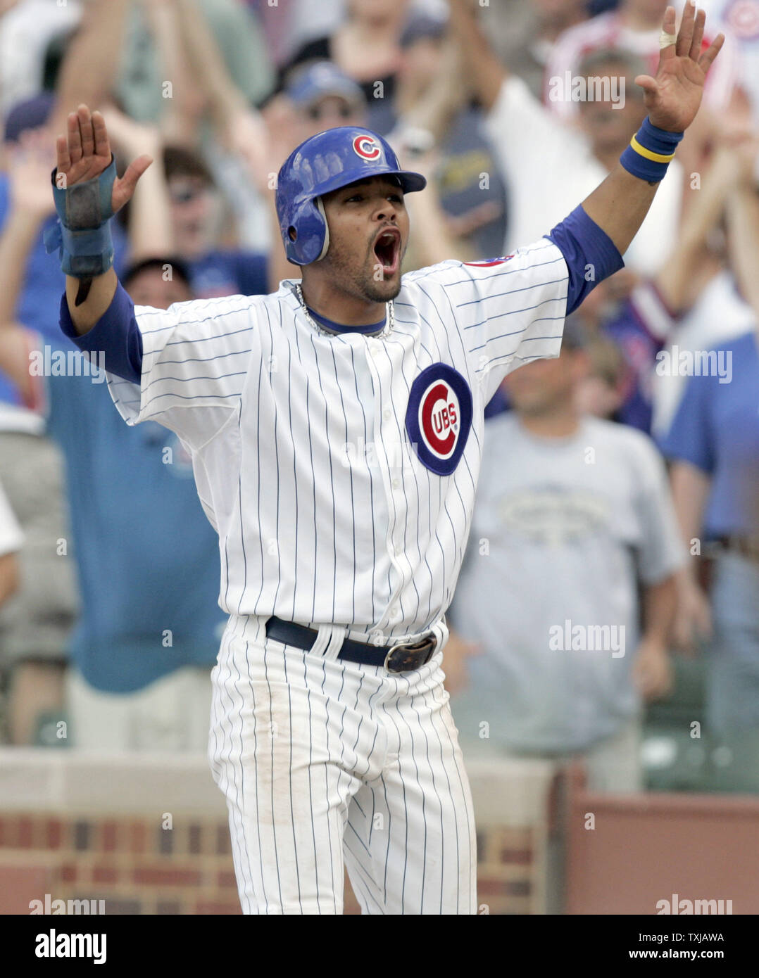 Chicago Cubs second baseman Andres Blanco (13) celebrates after scoring ...