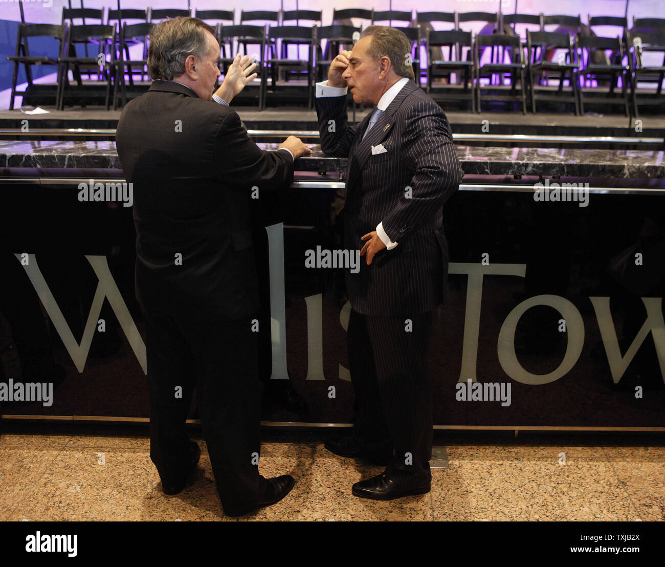 Willis Group Holdings Chairman and CEO Joseph J. Plumeri (R) talks with ...