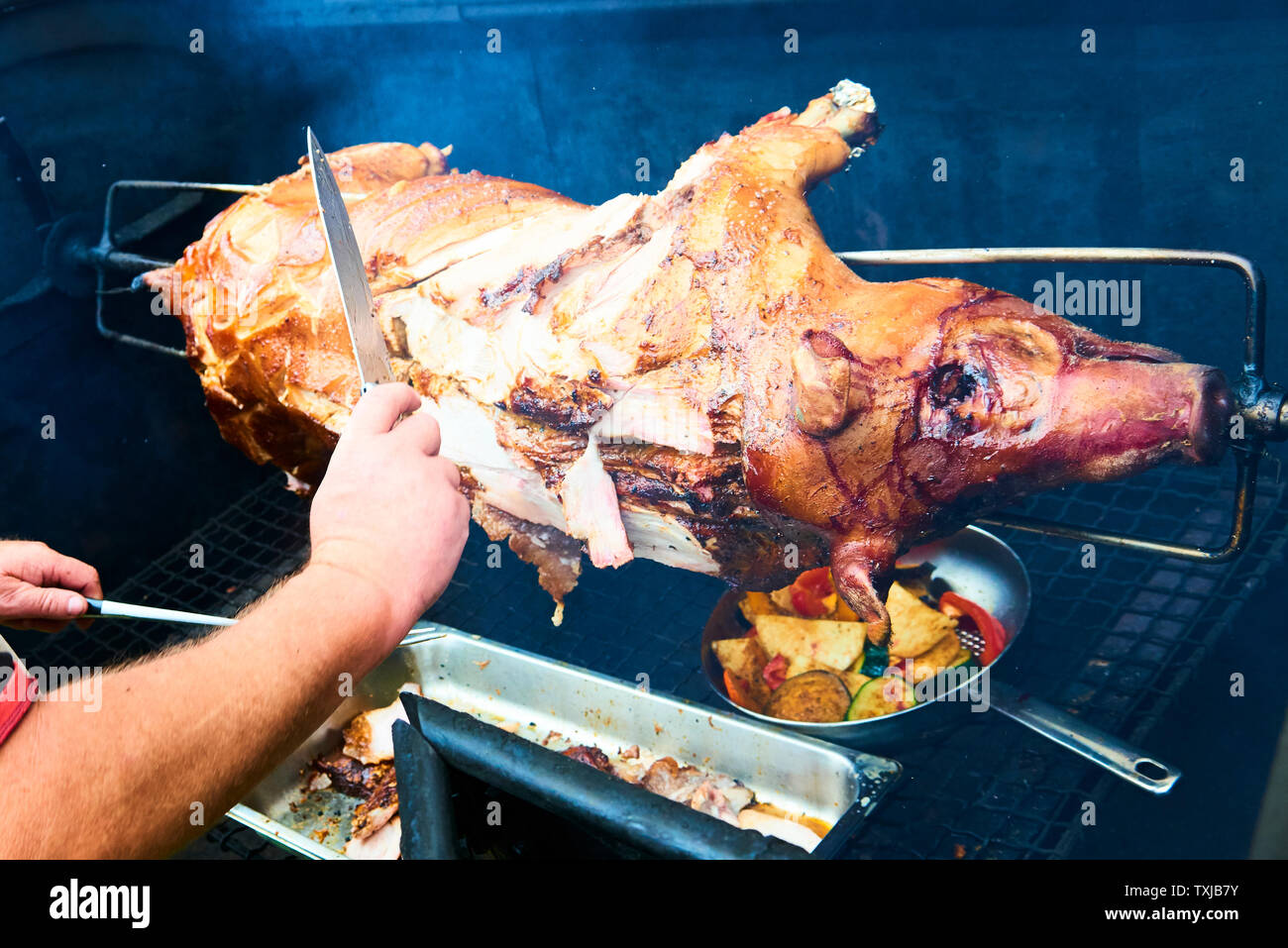 Pig pork cutting party barbecue hi-res stock photography and images - Alamy