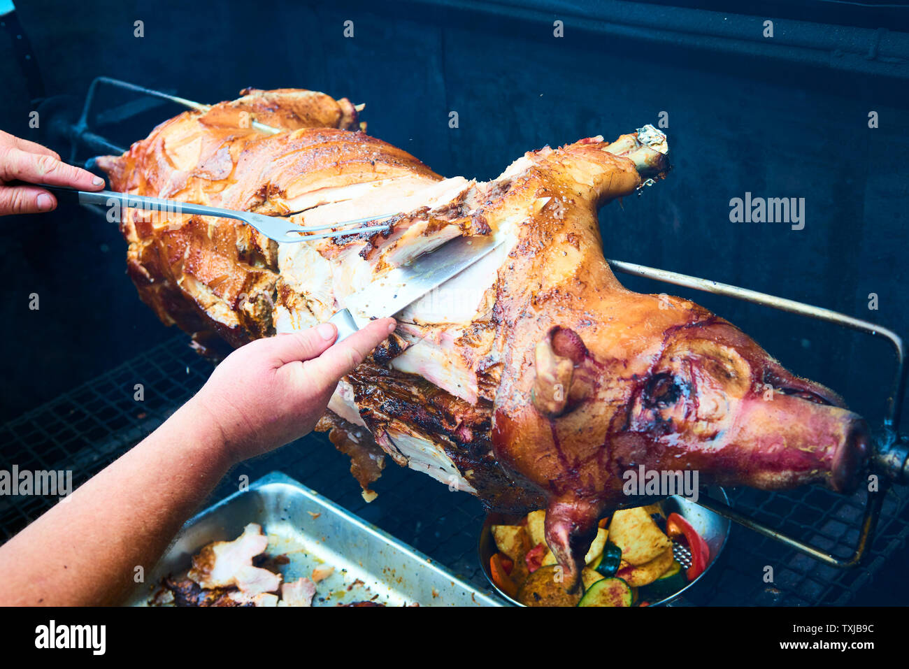 Pig pork cutting party barbecue hi-res stock photography and images - Alamy