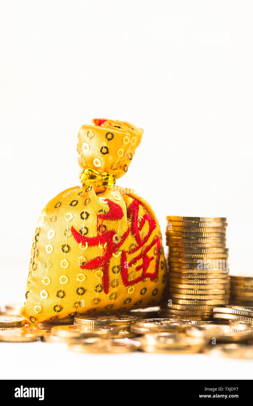 Fortune bag on white background with gold coin Stock Photo - Alamy
