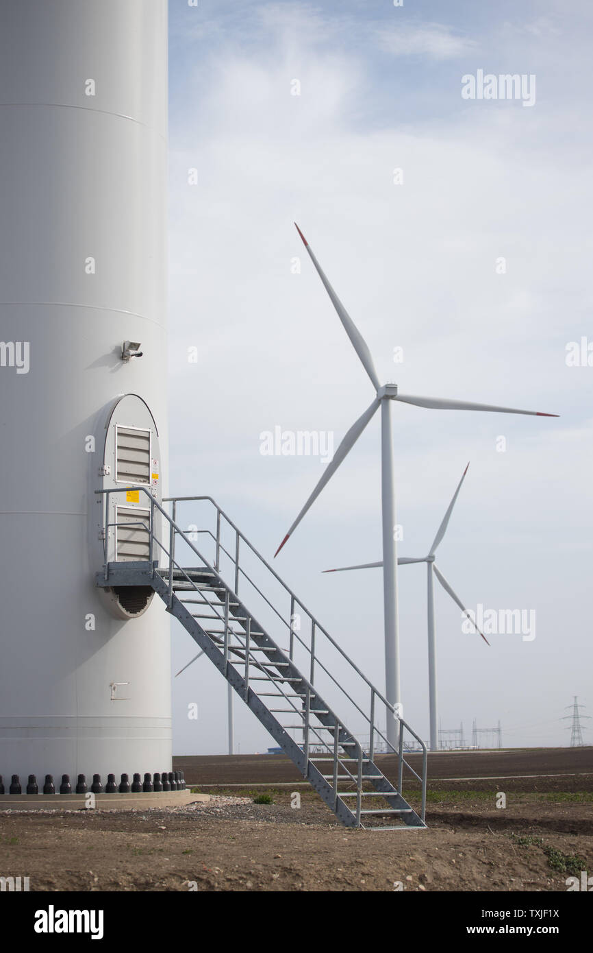 Close up of stairs and door of Wind turbine with two turbines in ...