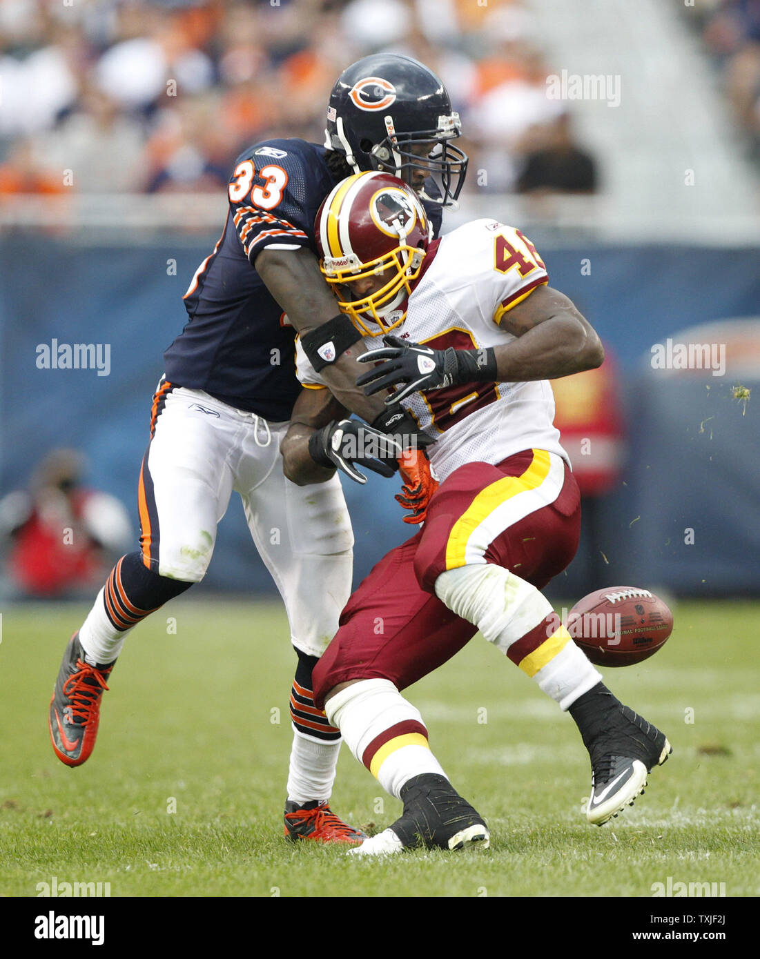 Chicago Bears cornerback Charles Tillman (L) forces Washington Redskins ...