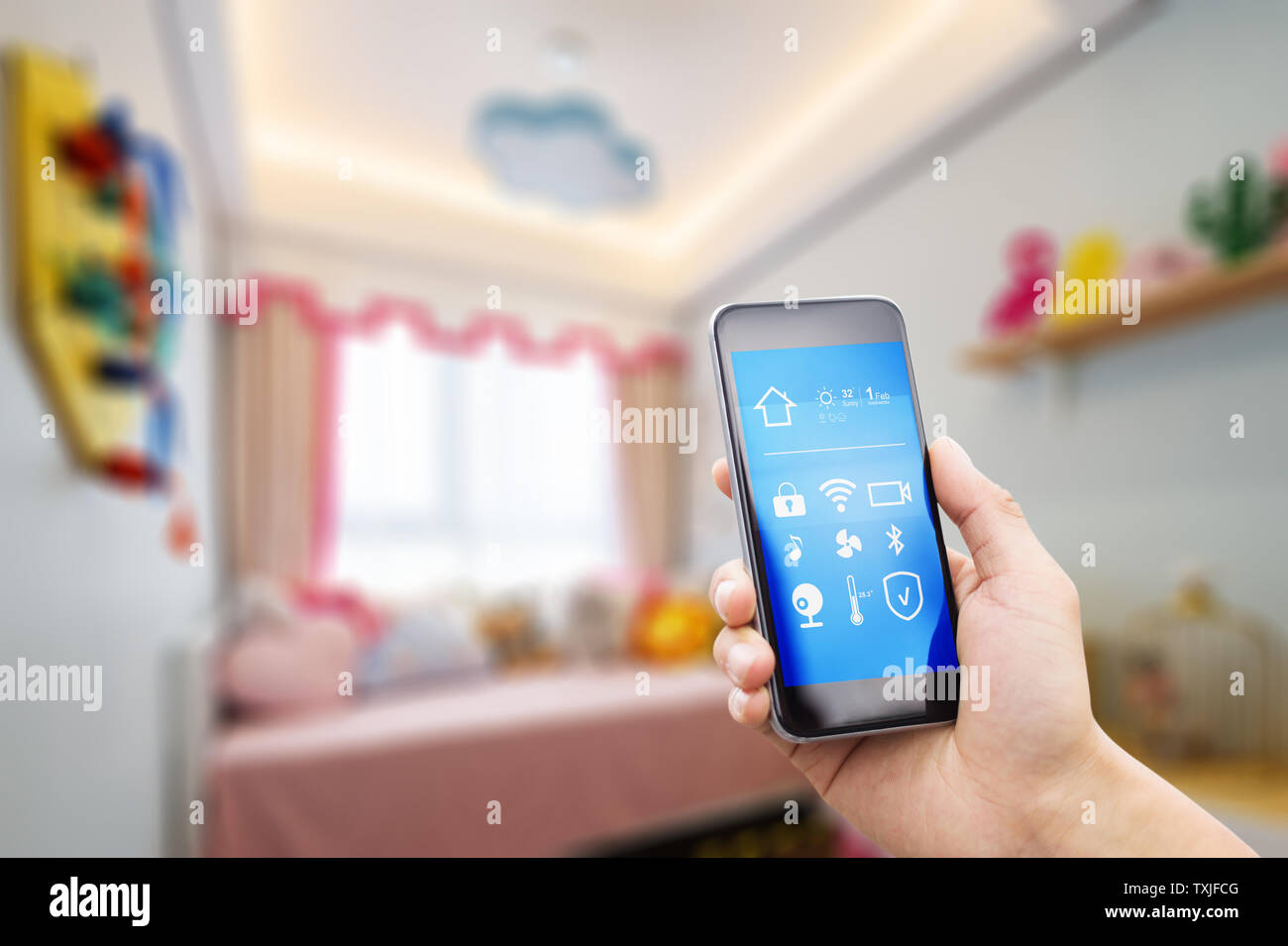 Mobile phone in smart home Stock Photo - Alamy