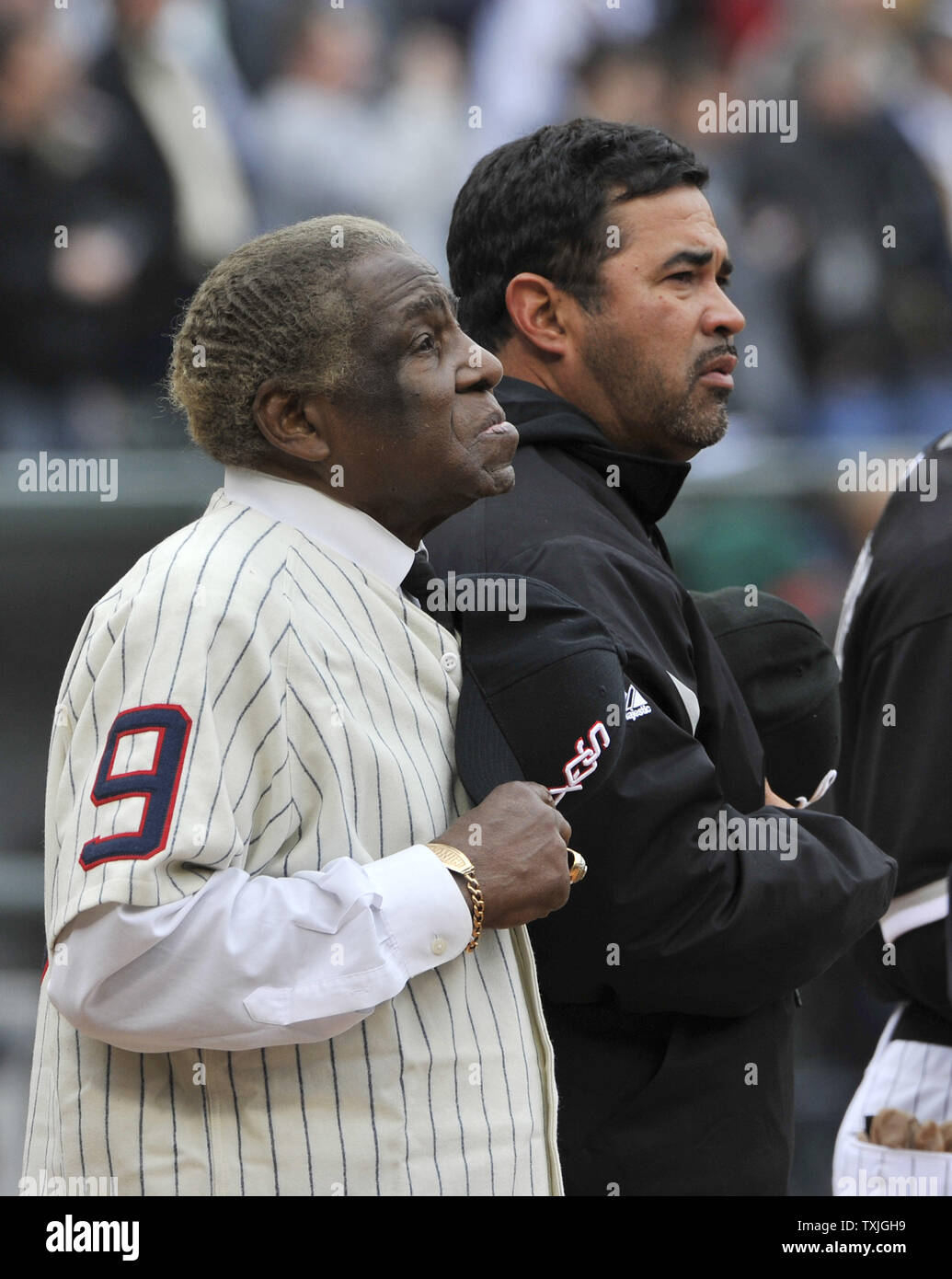 Former Chicago White Sox left fielder Minnie Minoso (L) stands with ...