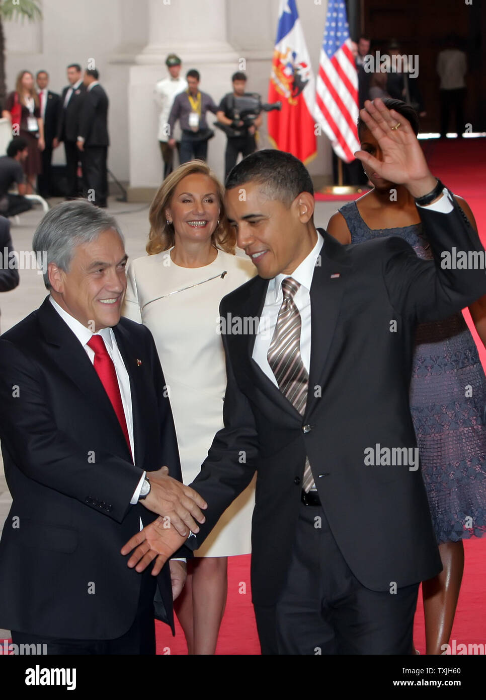 U.S. President Barack Obama is greeted by Chile's President Sebastian ...