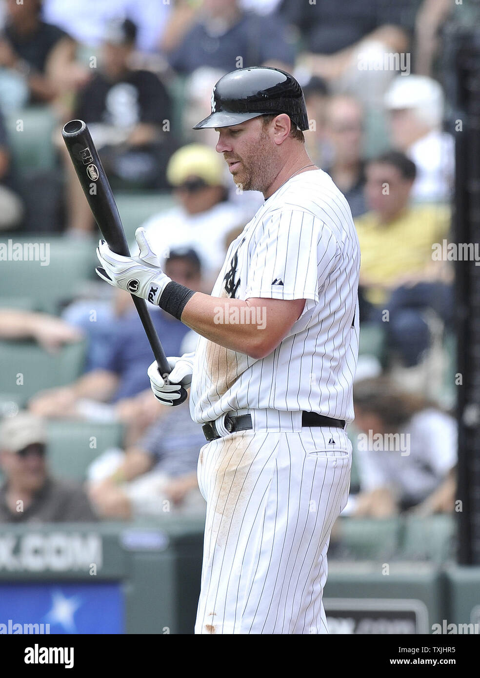 Chicago White Sox first baseman Adam Dunn waits to bat during the first ...