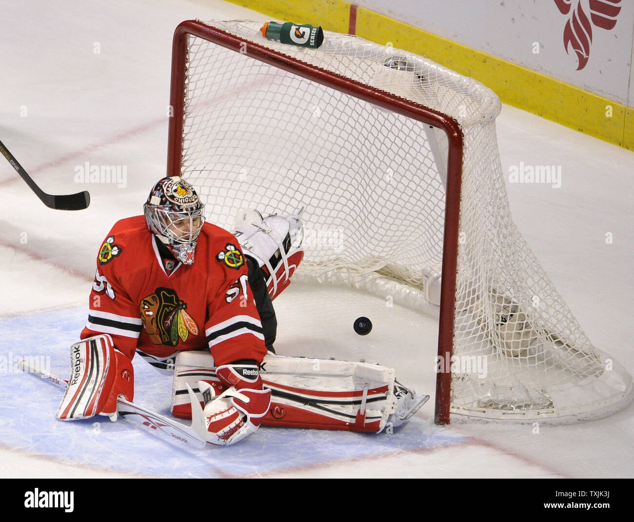 Chicago Blackhawks goalie Corey Crawford looks back as Nashville ...