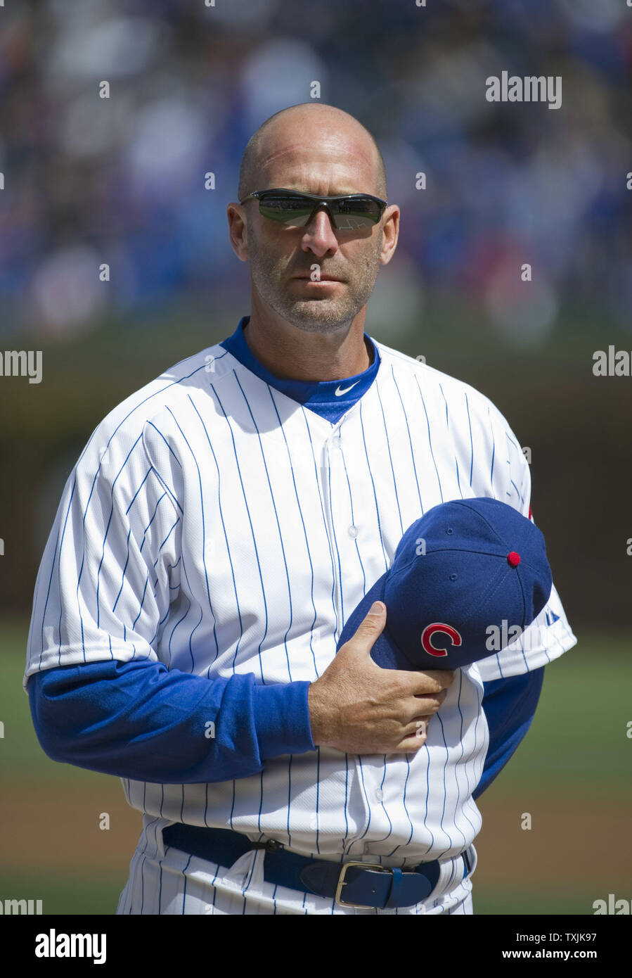 Chicago Cubs manager Dale Sveum stands on the field during the singing ...