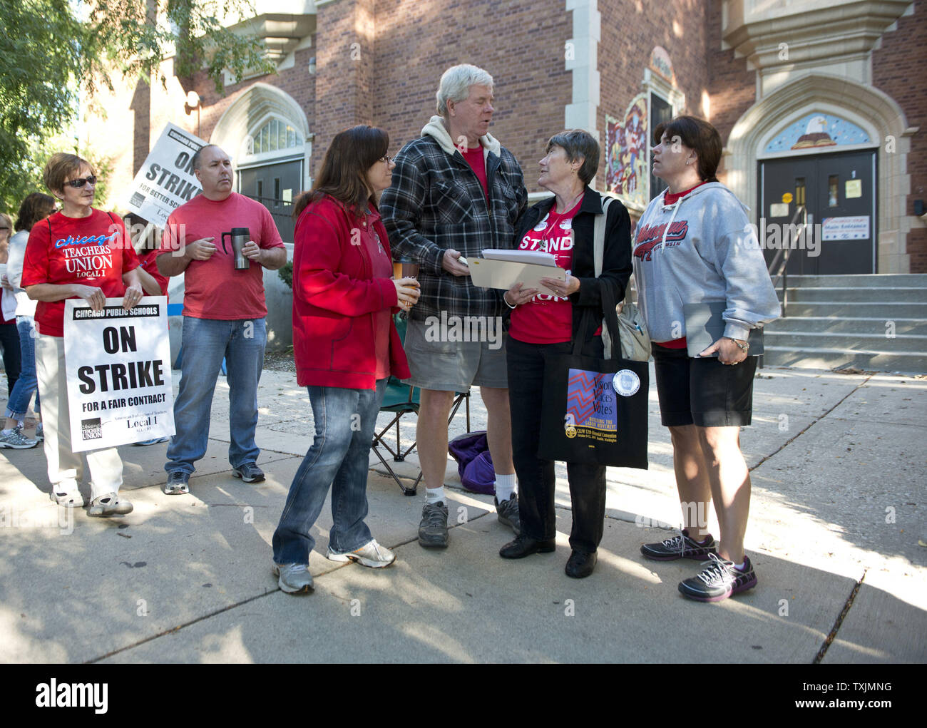 Members of the Chicago Teachers Union picket in front of Ebinger ...