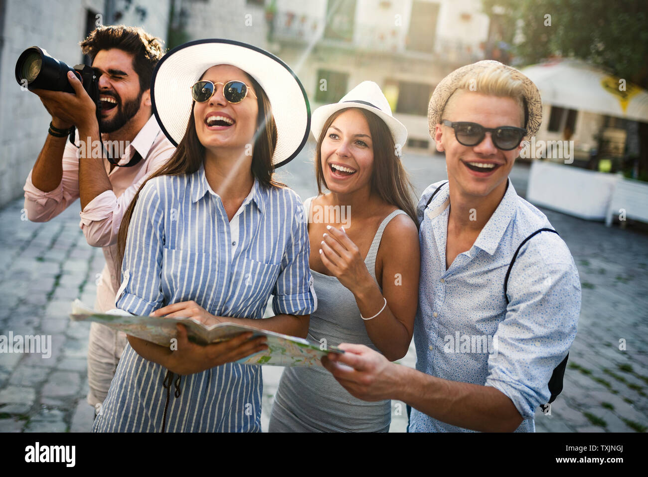 Happy group of tourists traveling and sightseeing together Stock Photo ...