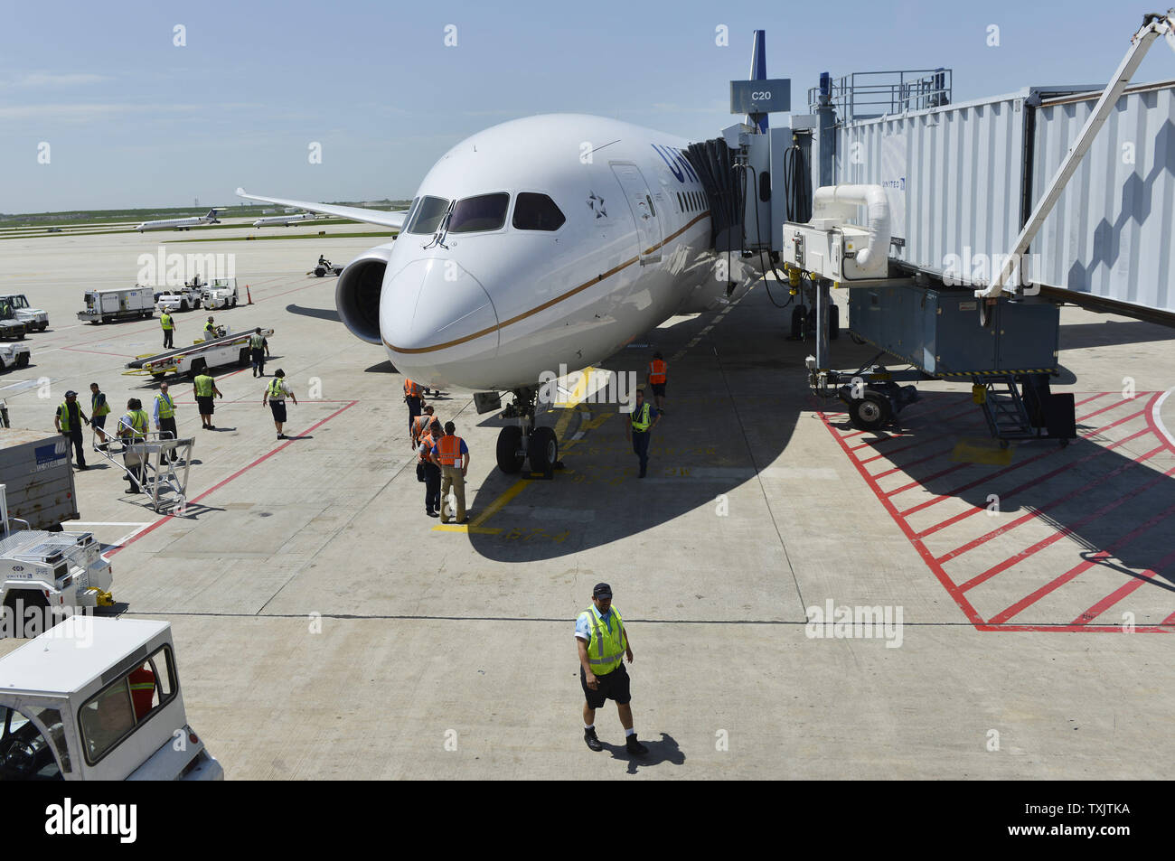 A Boeing 787 Dreamliner parks at a gate at O'Hare International Airport ...