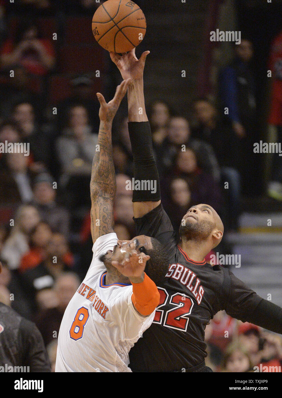Chicago Bulls forward Taj Gibson (R) gets a rebound away from New York ...