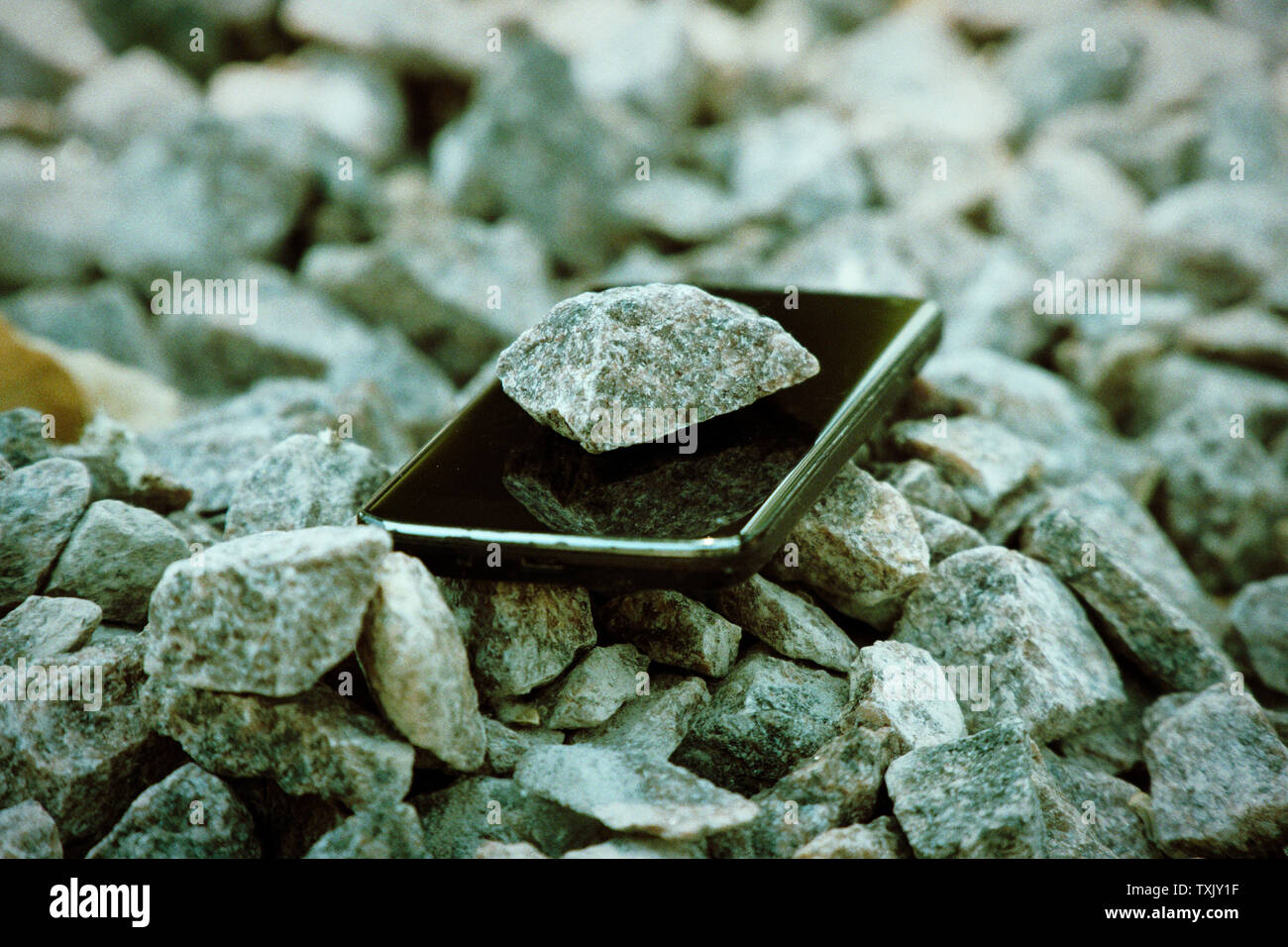 Cell phone with broken glass on gravel granite stones, unbreakable ...