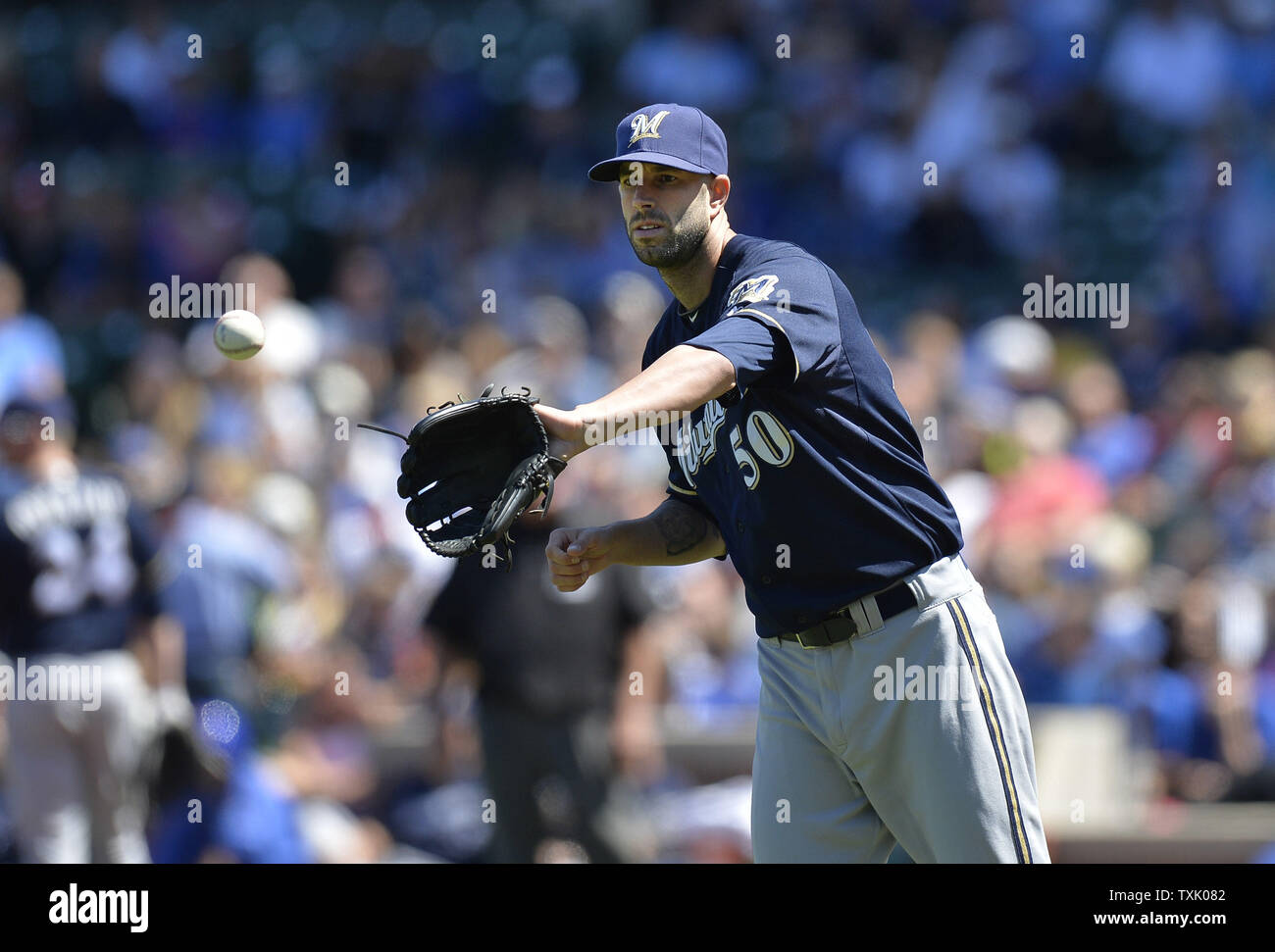 Milwaukee Brewers starting pitcher Mike Fiers gets the ball back during ...