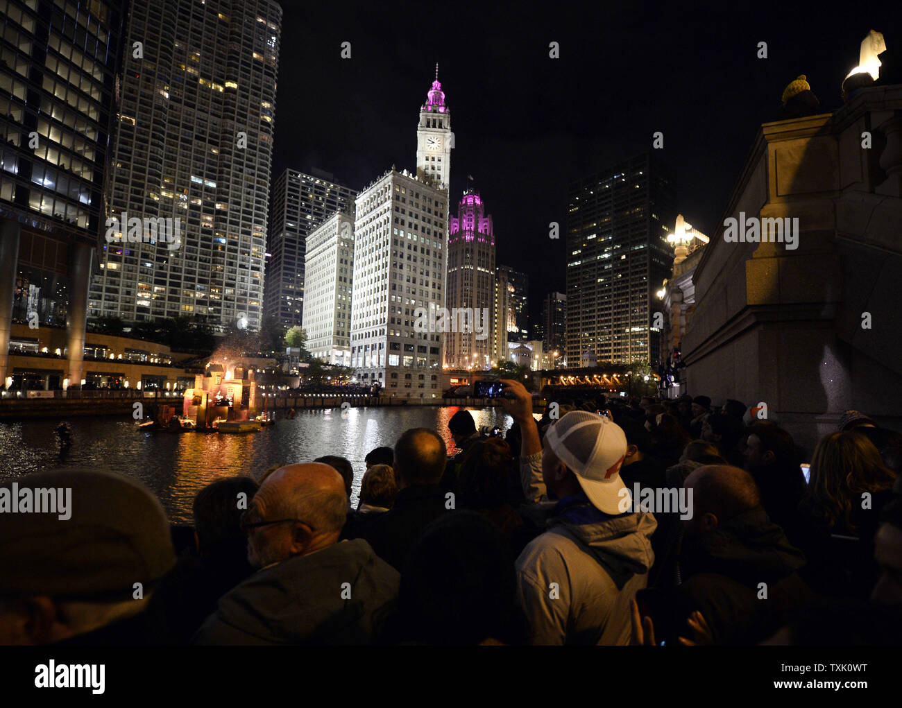 A house-like sculpture is set on fire as part of the "Grand Spectacle ...