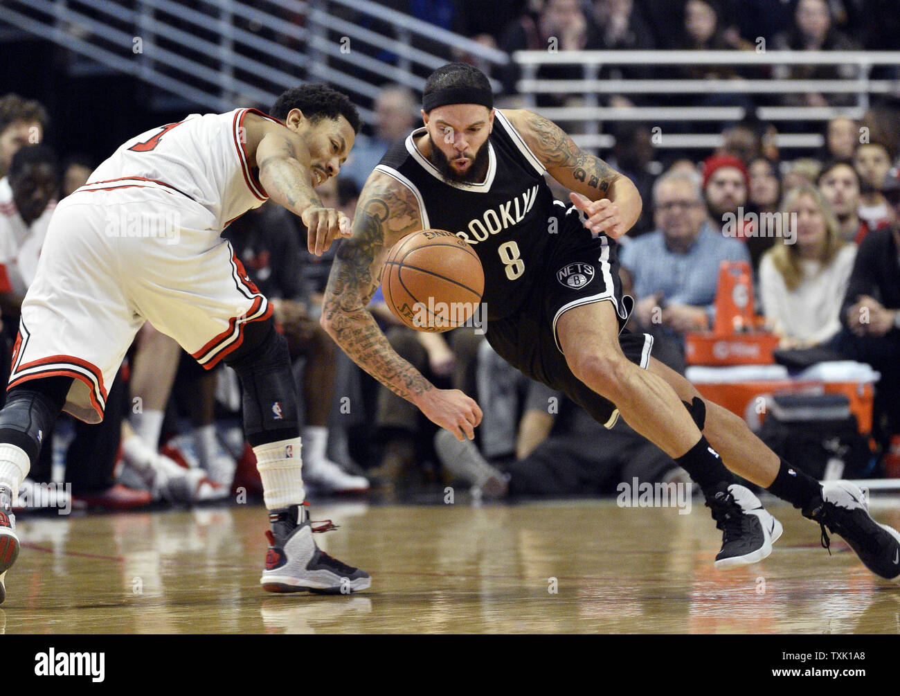 Brooklyn Nets guard Deron Williams (R) steals the ball from Chicago ...