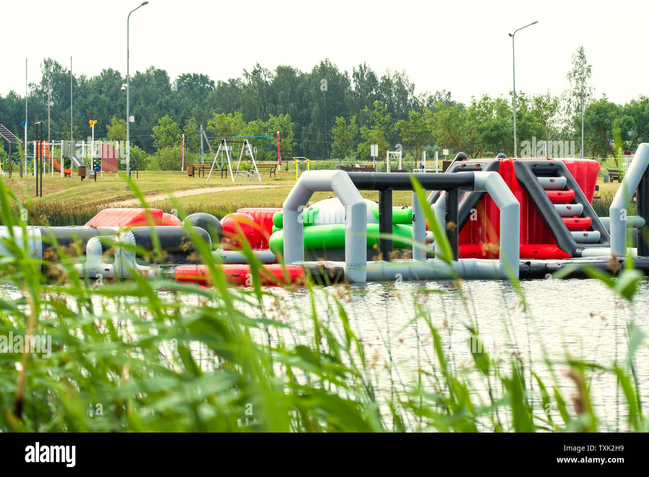 Inflatable playground for children in the lake Stock Photo - Alamy
