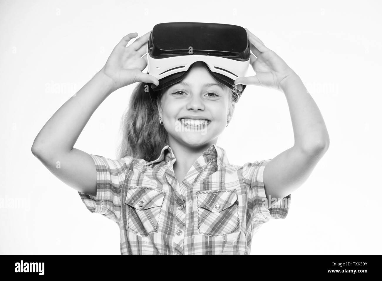 Get virtual experience. Girl cute child with head mounted display on ...