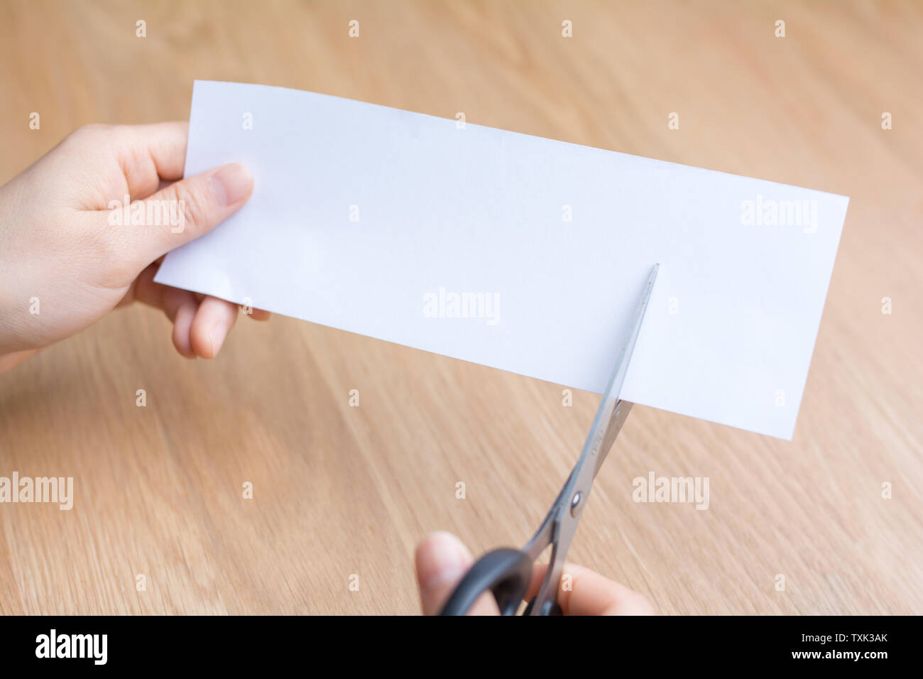 woman cutting white paper Stock Photo - Alamy