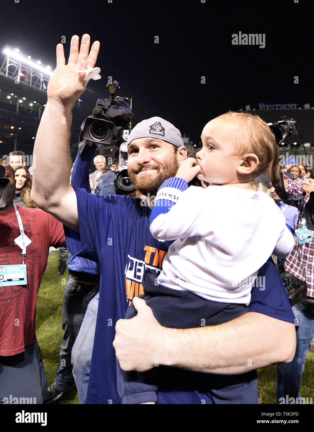 New York Mets second baseman Daniel Murphy holds his son Noah after ...