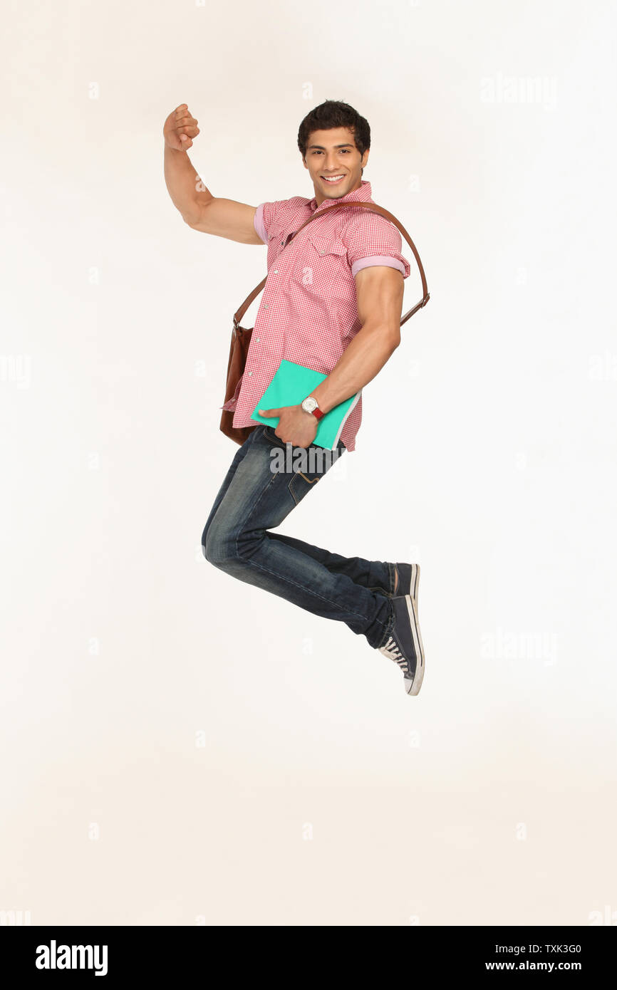 College student jumping in air Stock Photo - Alamy