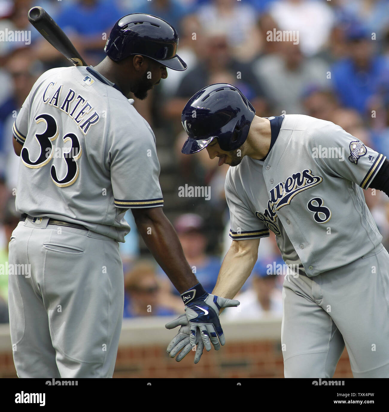 Milwaukee Brewers' Ryan Braun is congratulated by Chris Carter after ...