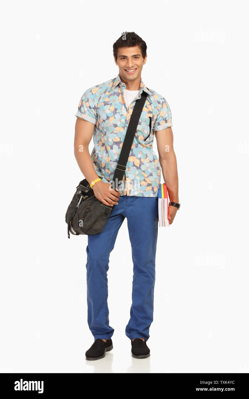 College student with a bag and smiling Stock Photo - Alamy