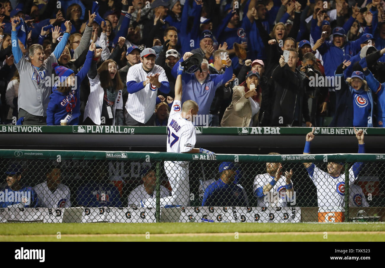 Chicago Cubs' Travis Wood celebrates after hitting a home run against ...