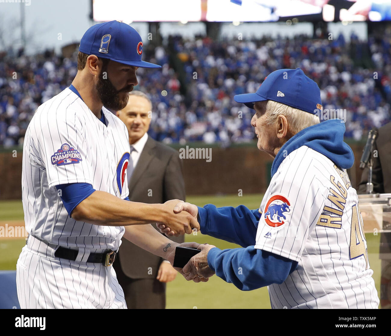 Chicago Cubs pitcher Jake Arrieta, left, receives a Championship Ring ...