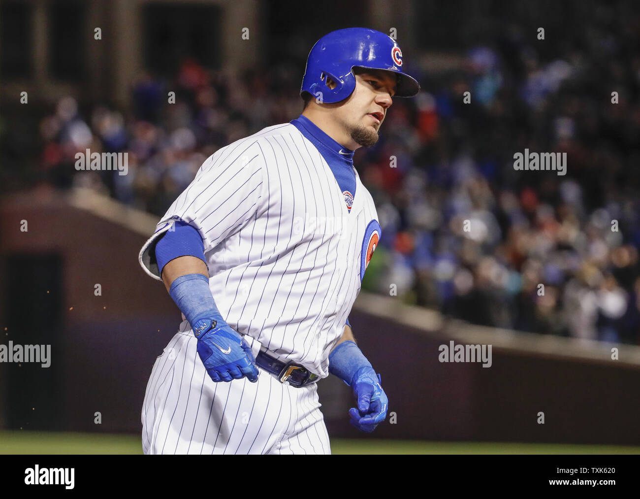 Chicago Cubs Kyle Schwarber runs the basses after hitting a three-run ...