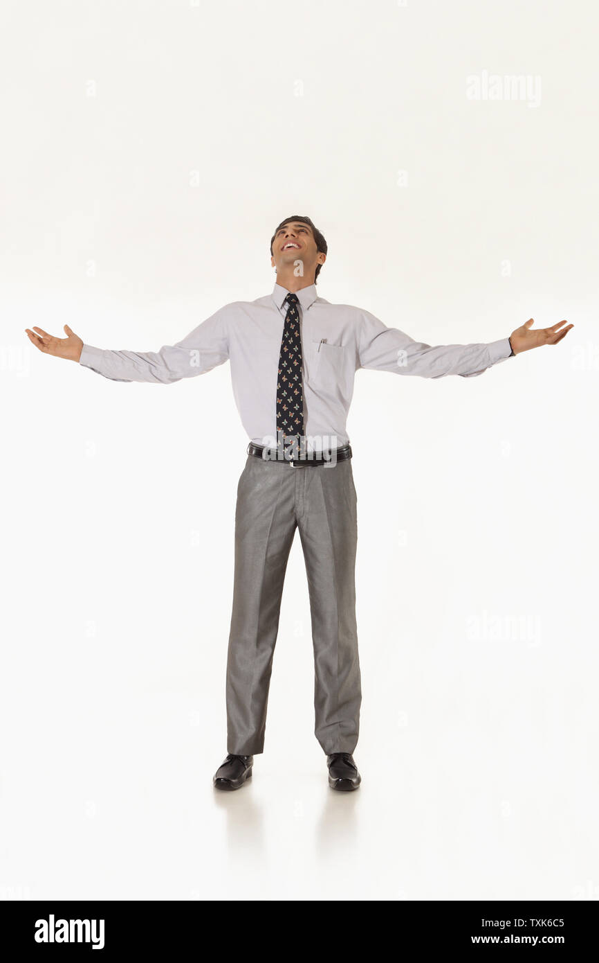 Businessman standing with his arm outstretched Stock Photo - Alamy