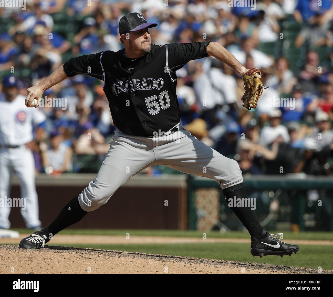 Colorado Rockies relief pitcher Chad Qualls delivers against the ...