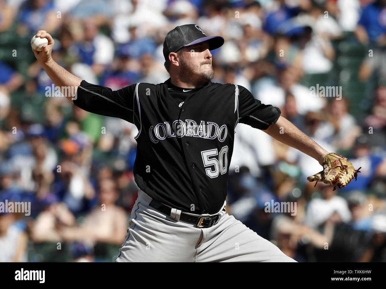 Colorado Rockies relief pitcher Chad Qualls delivers against the ...
