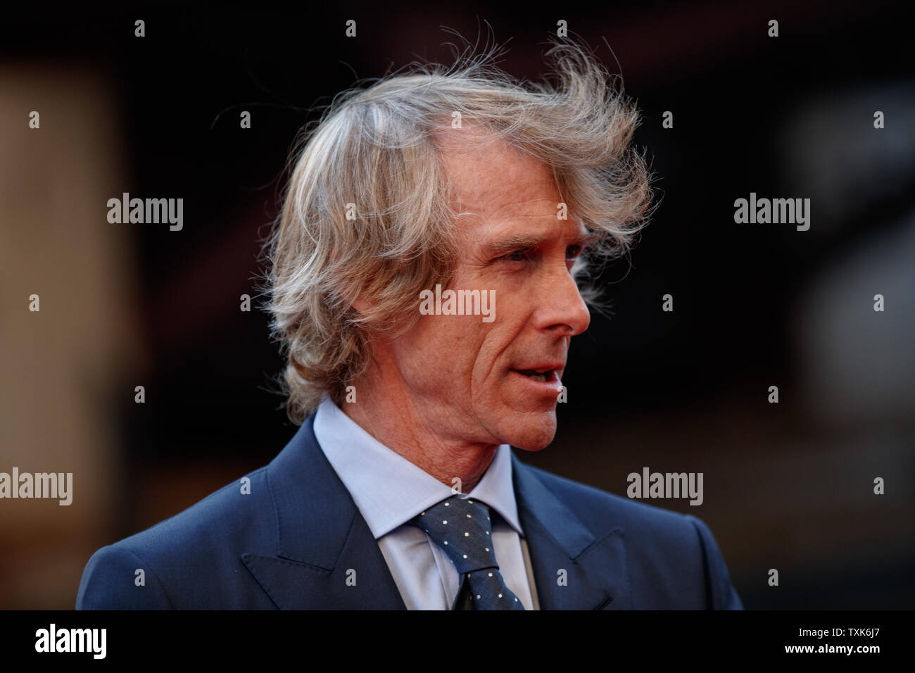 Director Michael Bay arrives on the red carpet at the Transformers The ...
