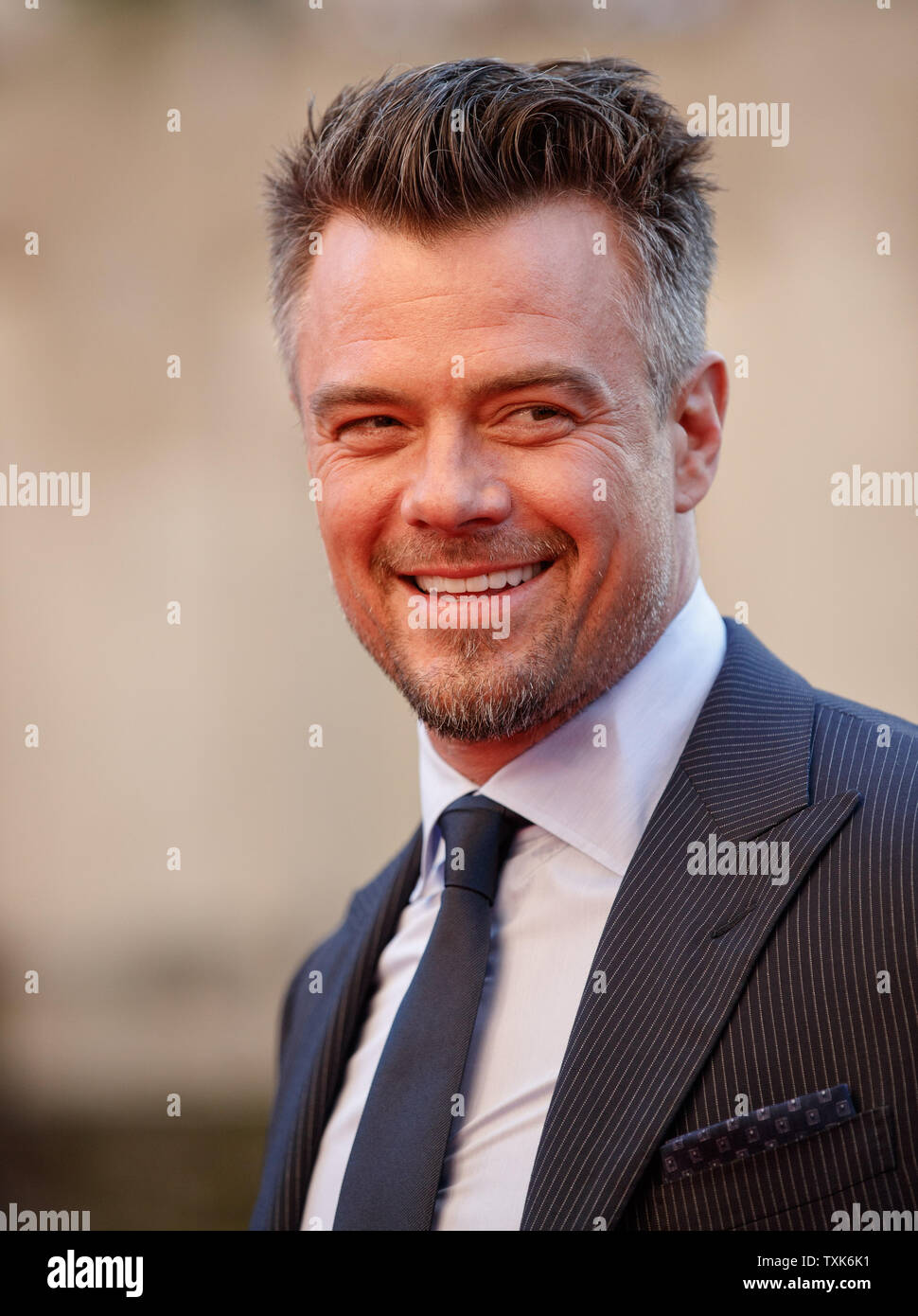 Actor John Duhamel arrives on the red carpet at the Transformers The ...
