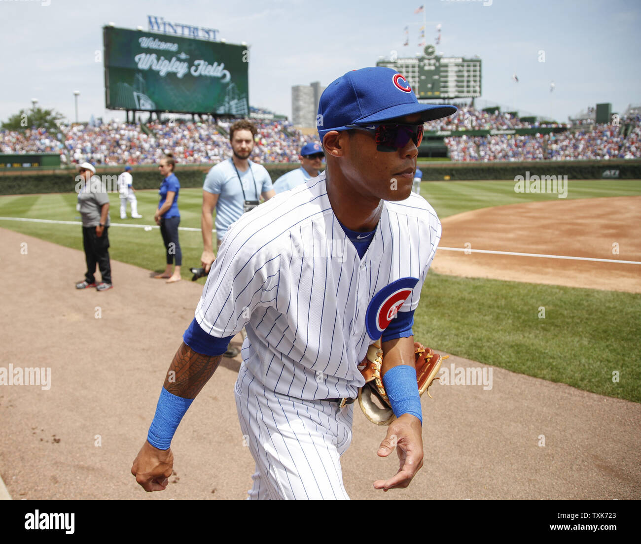 Chicago Cubs shortstop Addison Russell walks on the field before ...