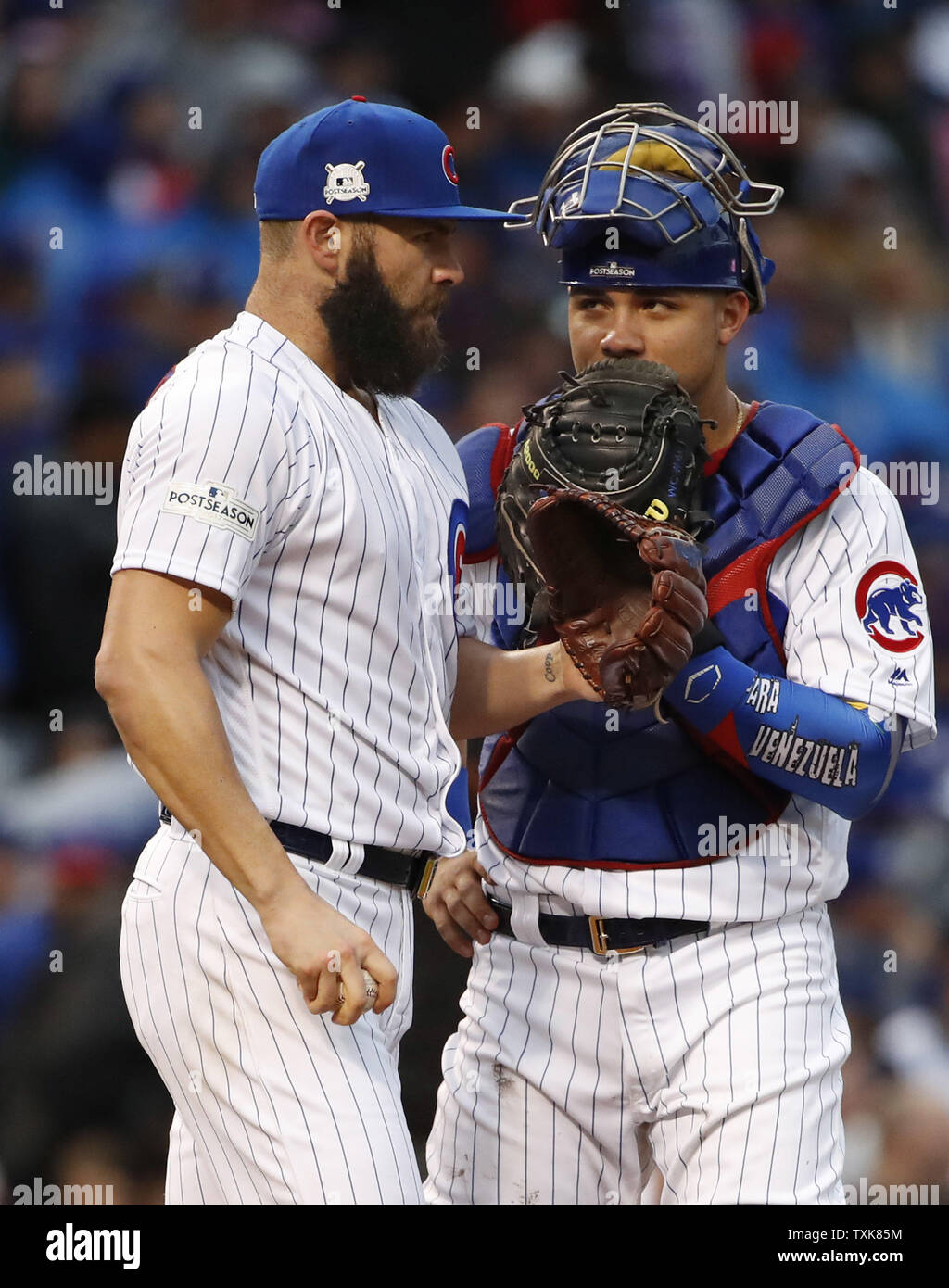 Chicago Cubs starting pitcher Jake Arrieta (L) talks to catcher Willson ...