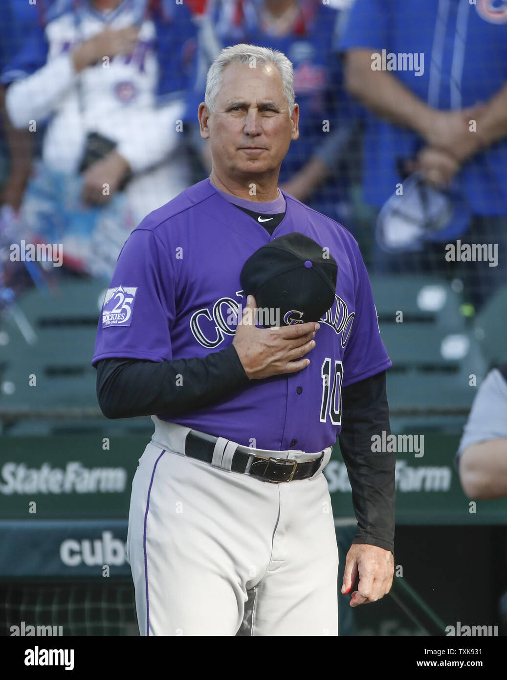 Colorado Rockies manager Bud Black (10) listens to the national anthem ...