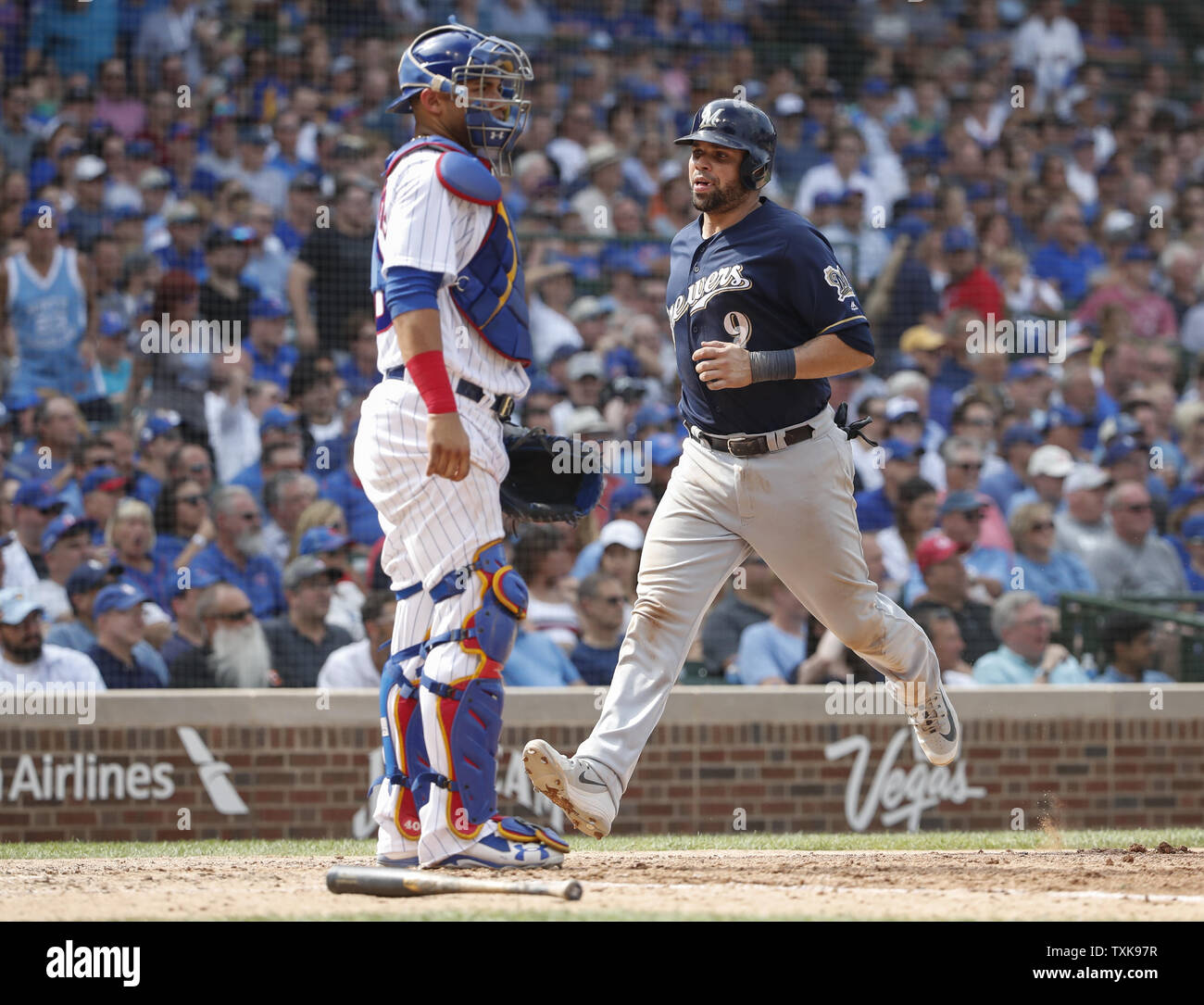 Milwaukee Brewers Manny Pina (9) scores against the Chicago Cubs in the ...