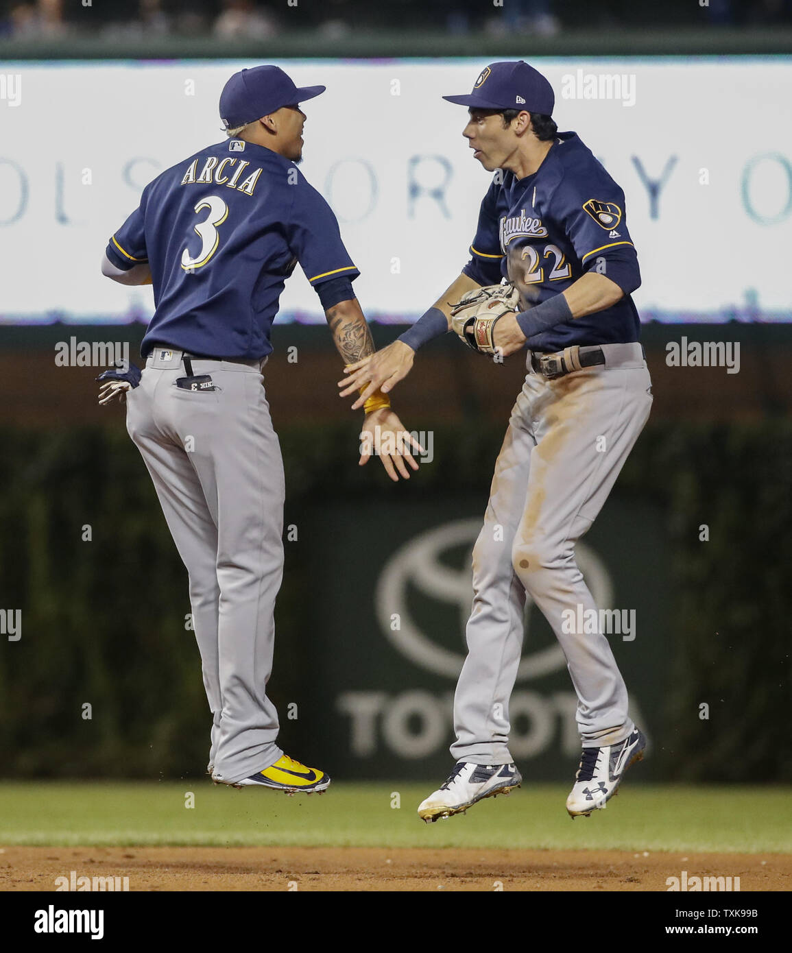 Milwaukee Brewers' Orlando Arcia (3) celebrates with Christian Yelich ...
