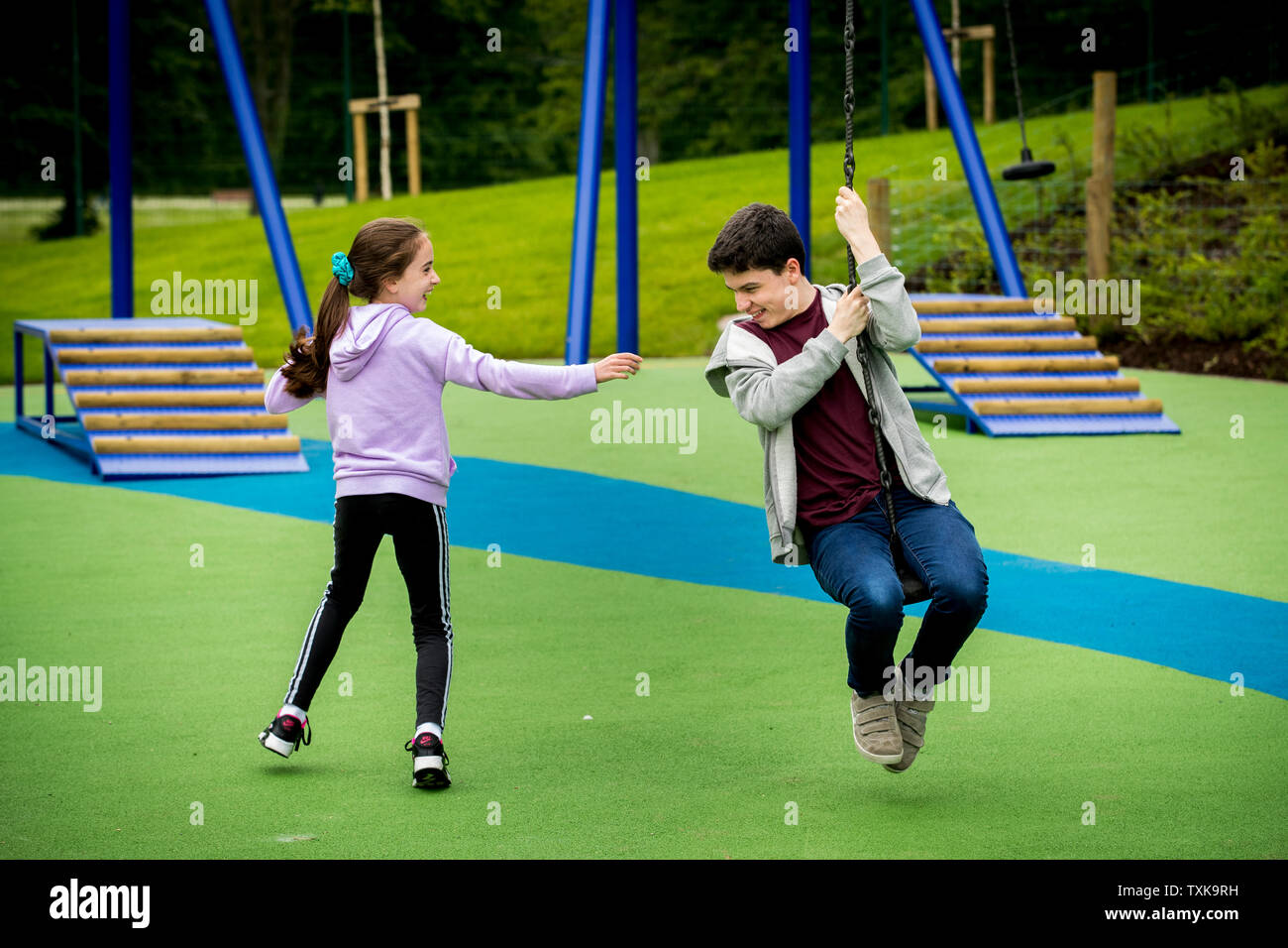 James Ardis playing on the zip line with his sister Emily during the ...