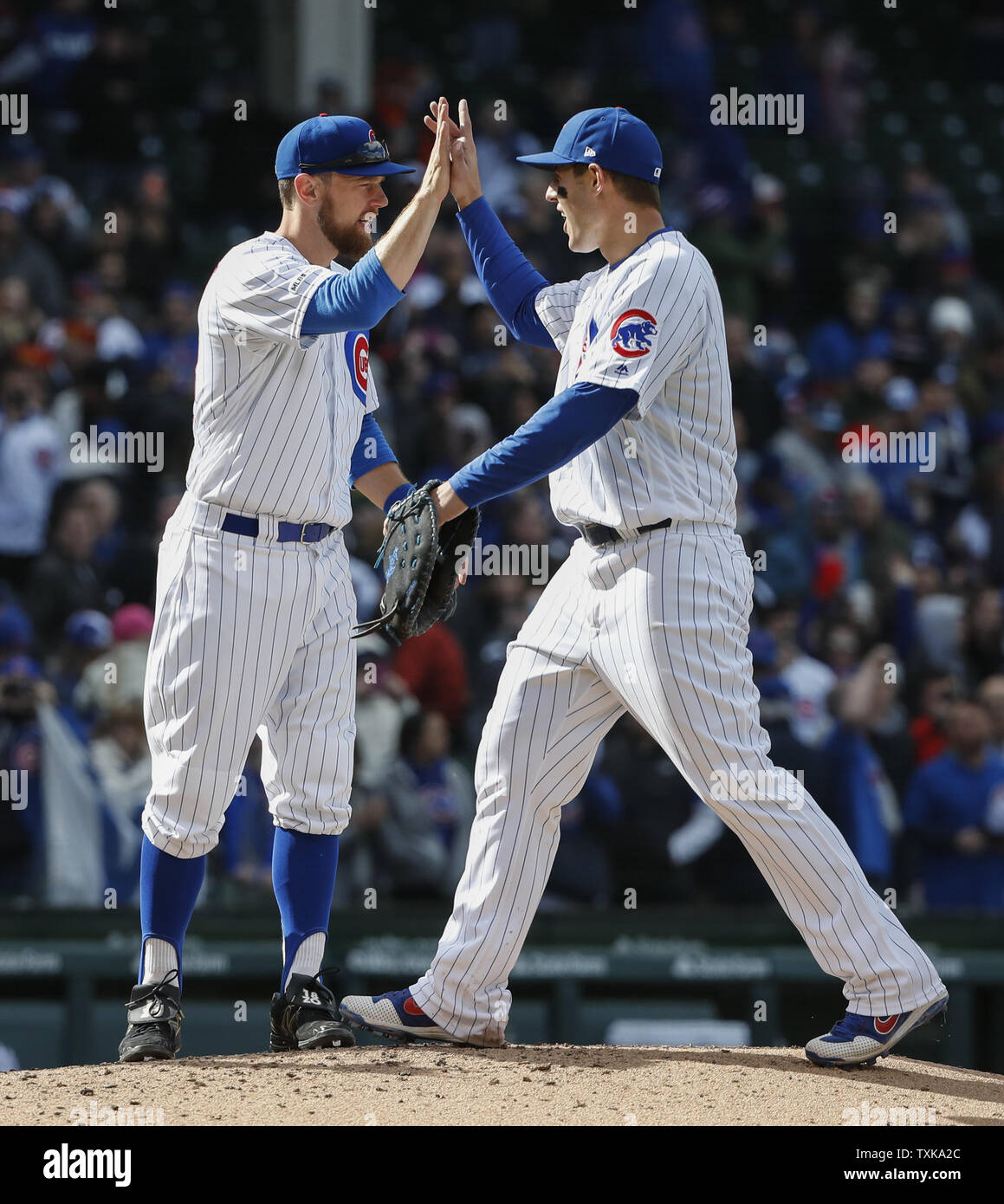 Chicago Cubs left fielder Ben Zobrist celebrates with first baseman ...