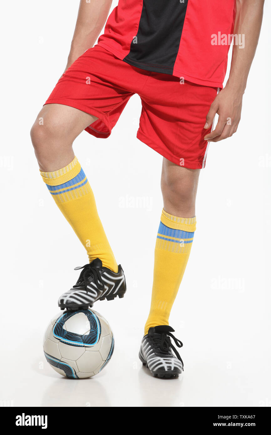 Soccer football player standing feet hi-res stock photography and ...