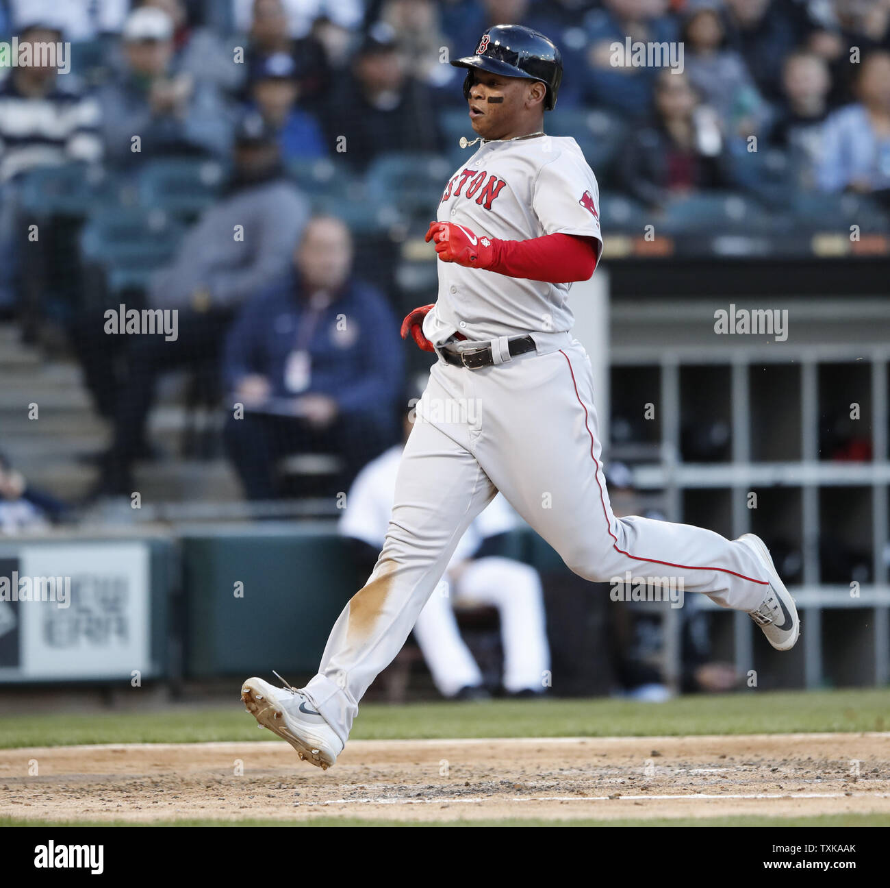 Boston Red Sox's Rafael Devers crosses home plate as he scores against ...