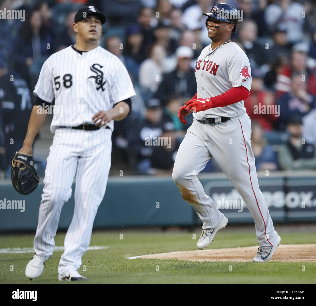 Boston Red Sox's Rafael Devers crosses home plate as he scores against ...